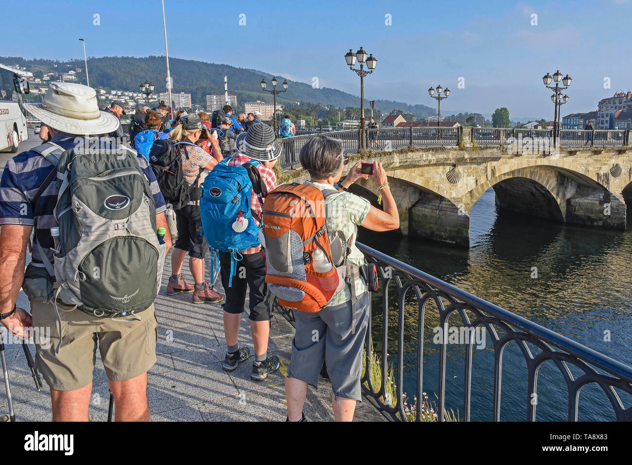 Spain, pilgrims are spotted walking the ancient roman bridge of ...