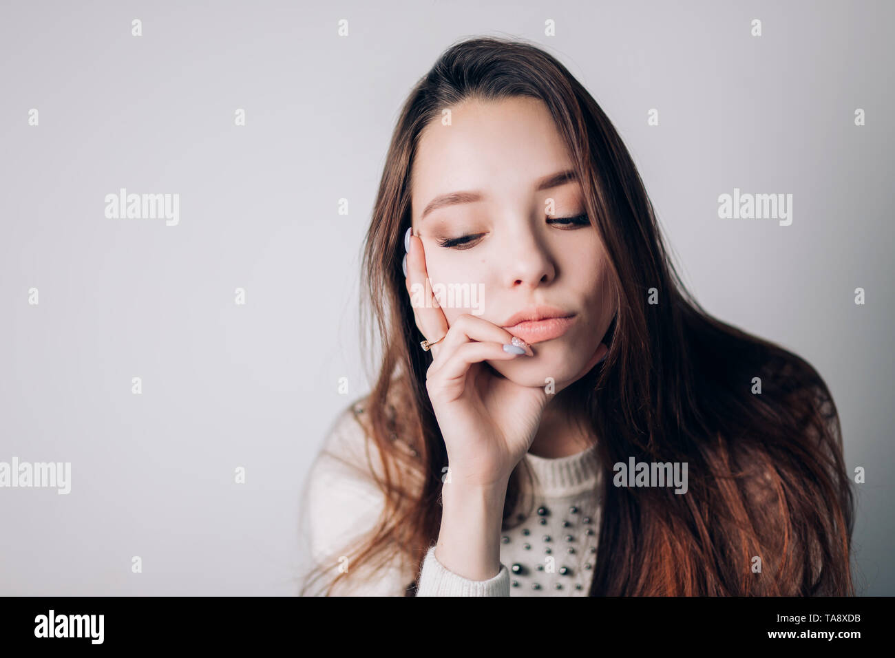 Close up of a sad and depressed woman looking to the side. Girl lowered ...