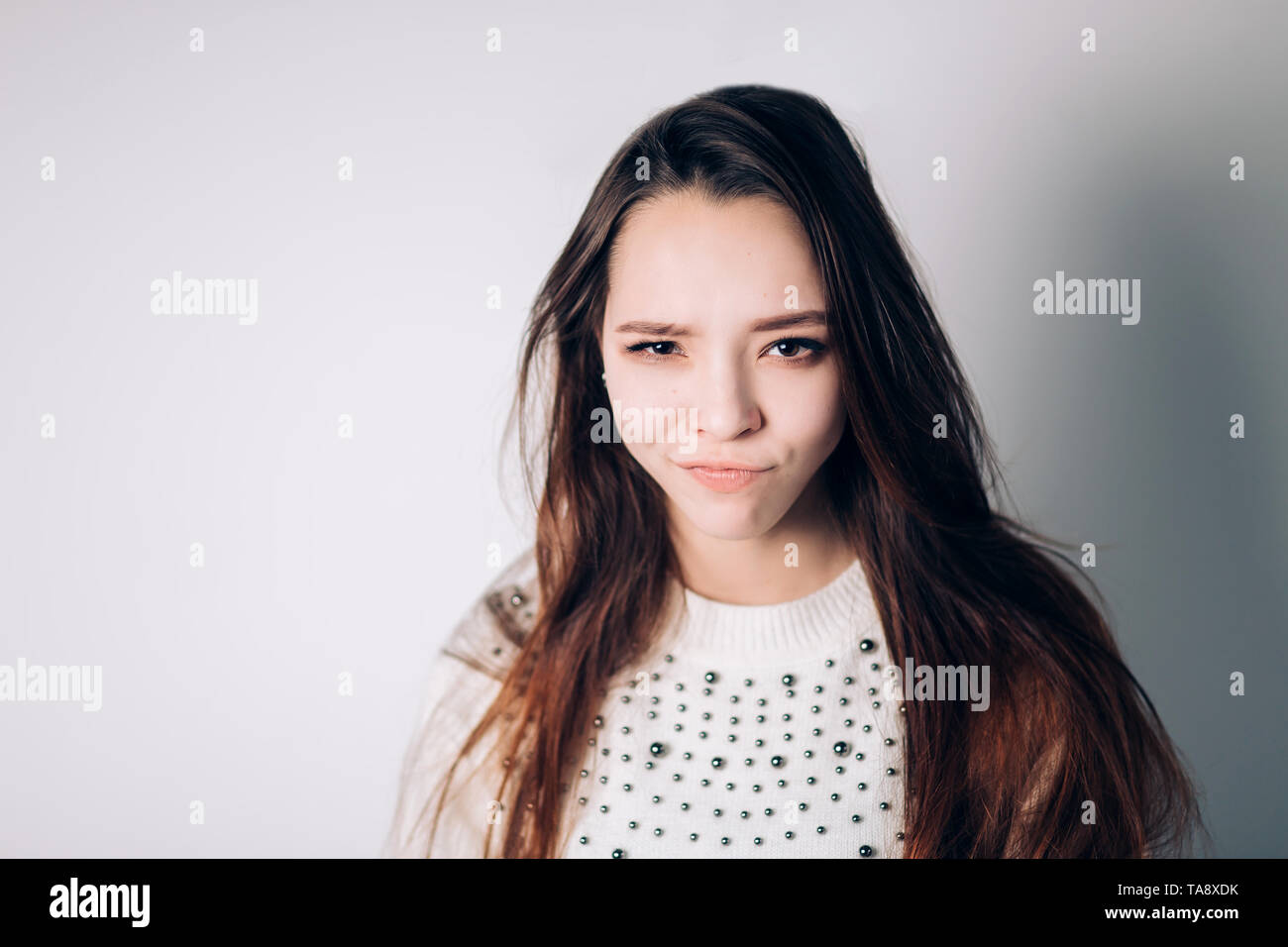 Portrait of funny emotional girl on white background. The woman with a ...