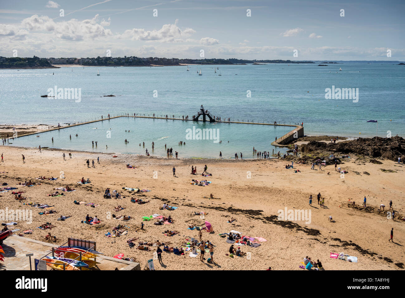 Seawater pool and people on sany beach, Saint Malo, Brittany, France ...