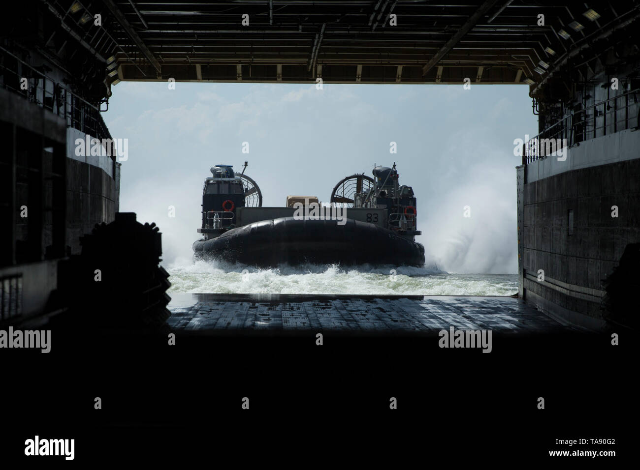 A U.S. Navy landing craft, air cushion (LCAC) prepares to board the San ...