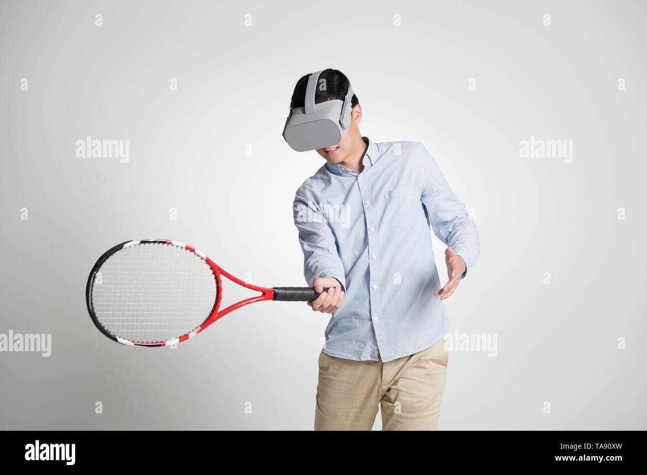 Young Japanese man using VR goggles Stock Photo - Alamy