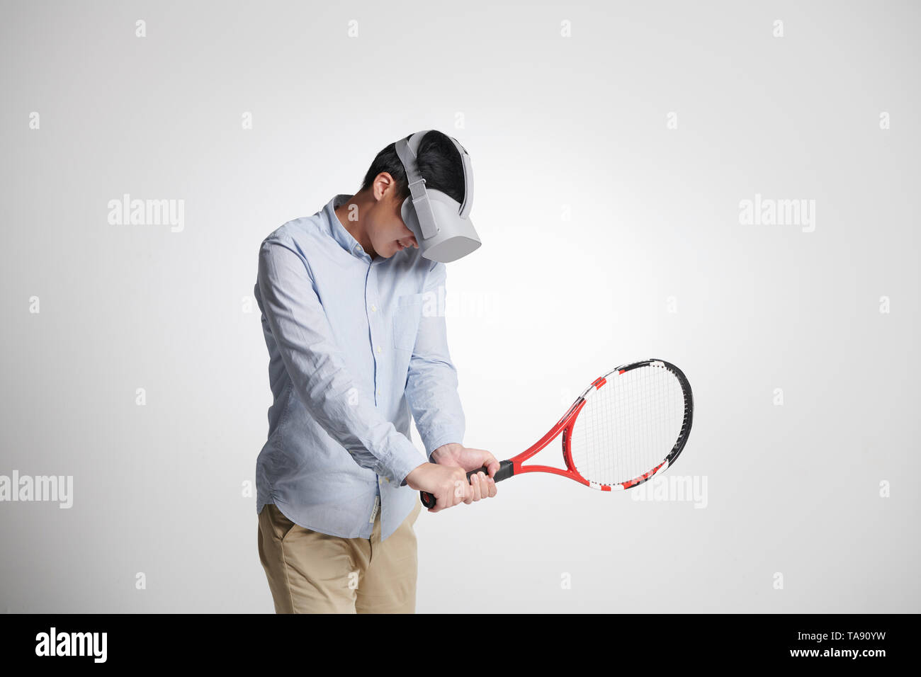 Young Japanese man using VR goggles Stock Photo - Alamy