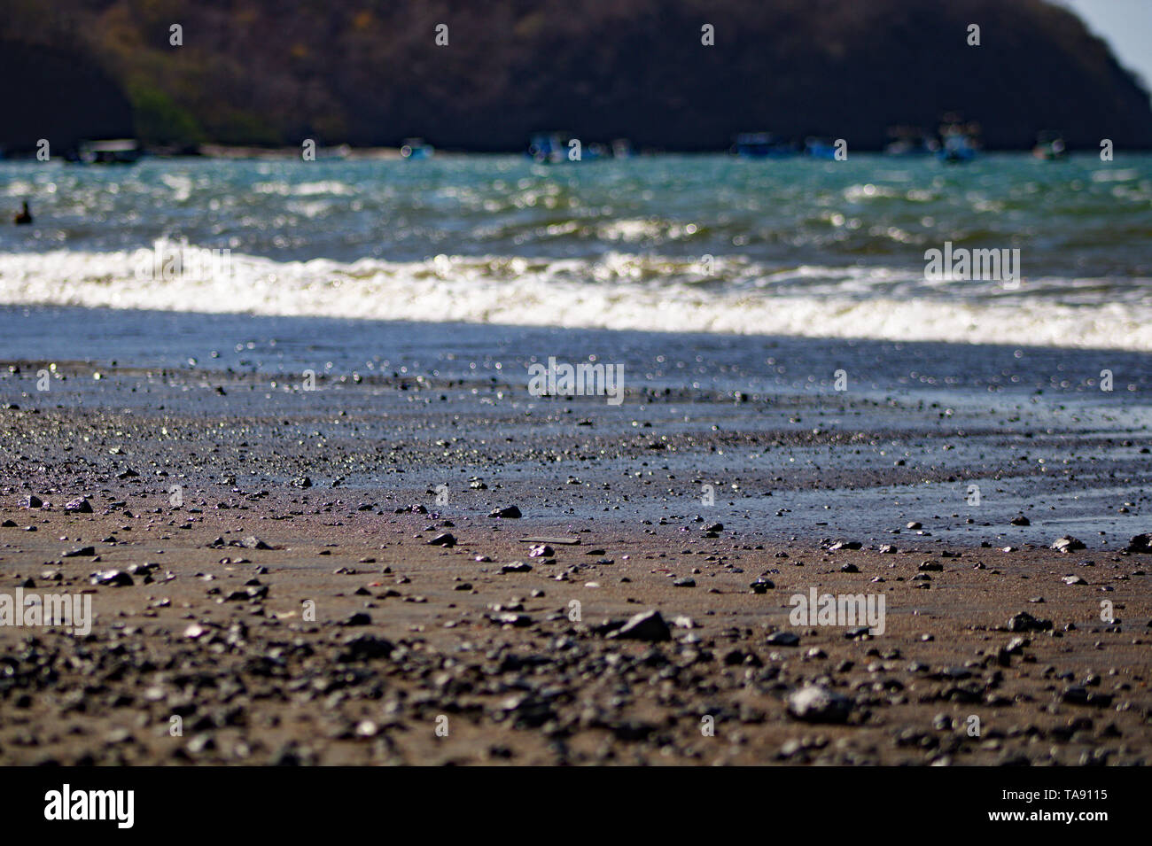 Rocky Beach with dark Sand in Costa Rica Stock Photo - Alamy