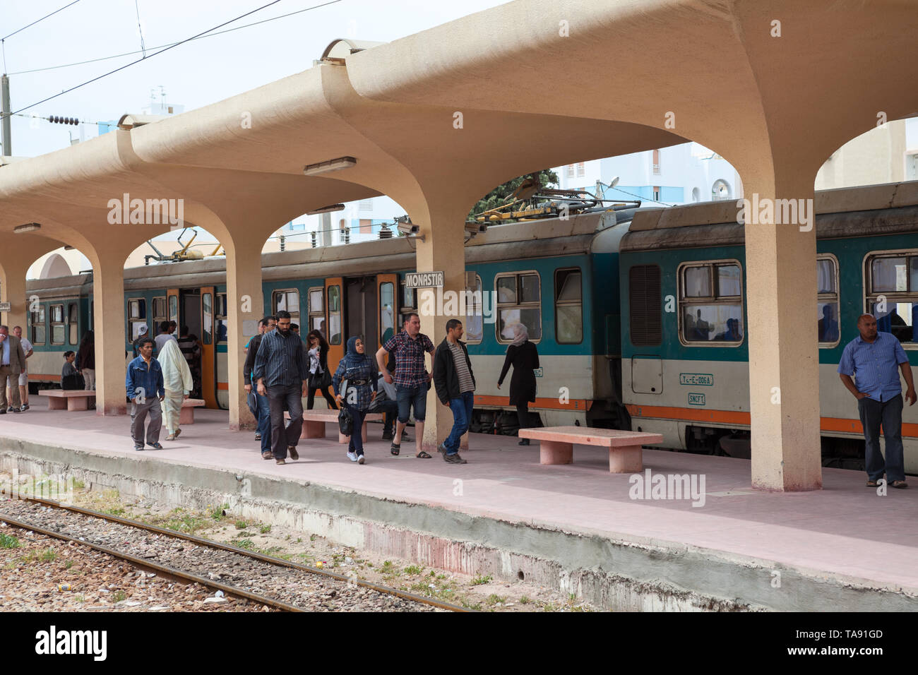 MONASTIR, TUNISIA-CIRCA MAY, 2012: Passengers alight arrived train in ...