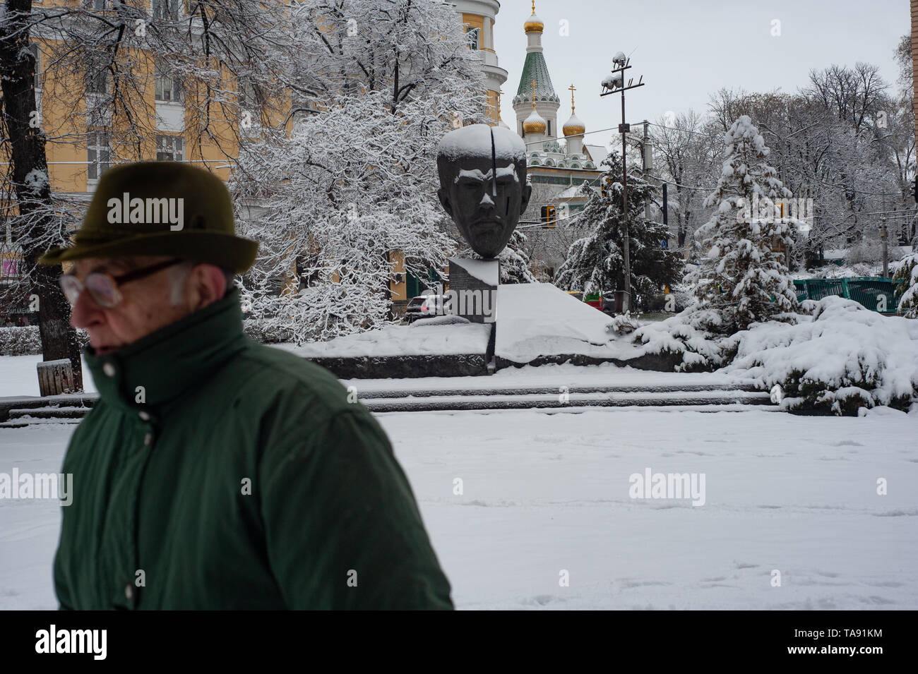 An Old Bulgarian man walks past the Stefan Stambolov Monument, in the ...