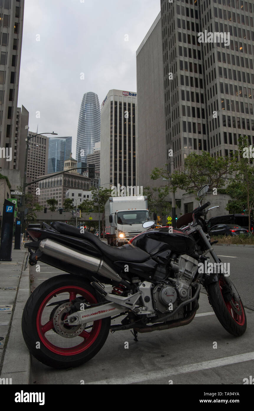 The Salesforce Tower can be seen in the background behind a motorcycle ...