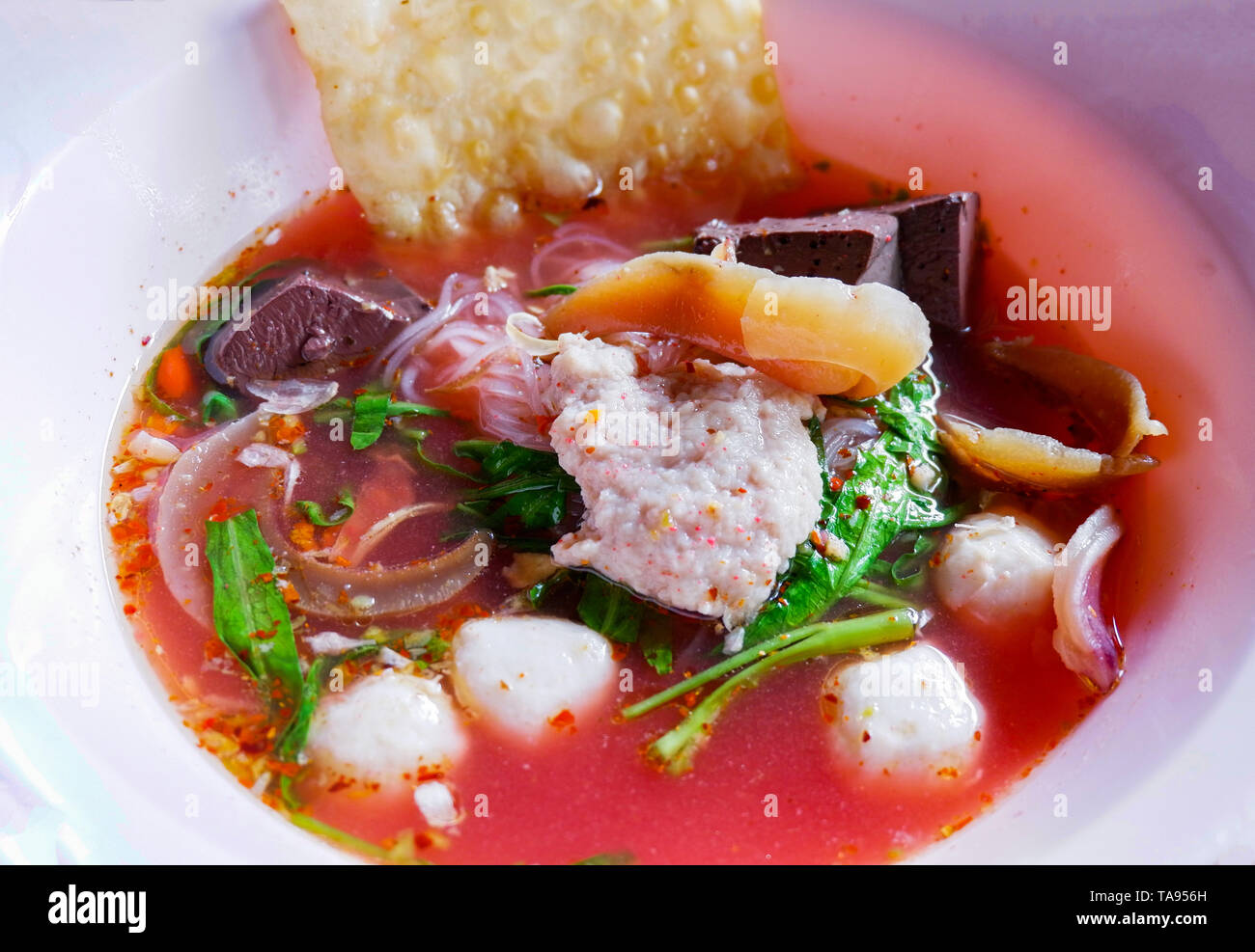 noodles with seafood on red soup / hot and spicy thai food noodle ...