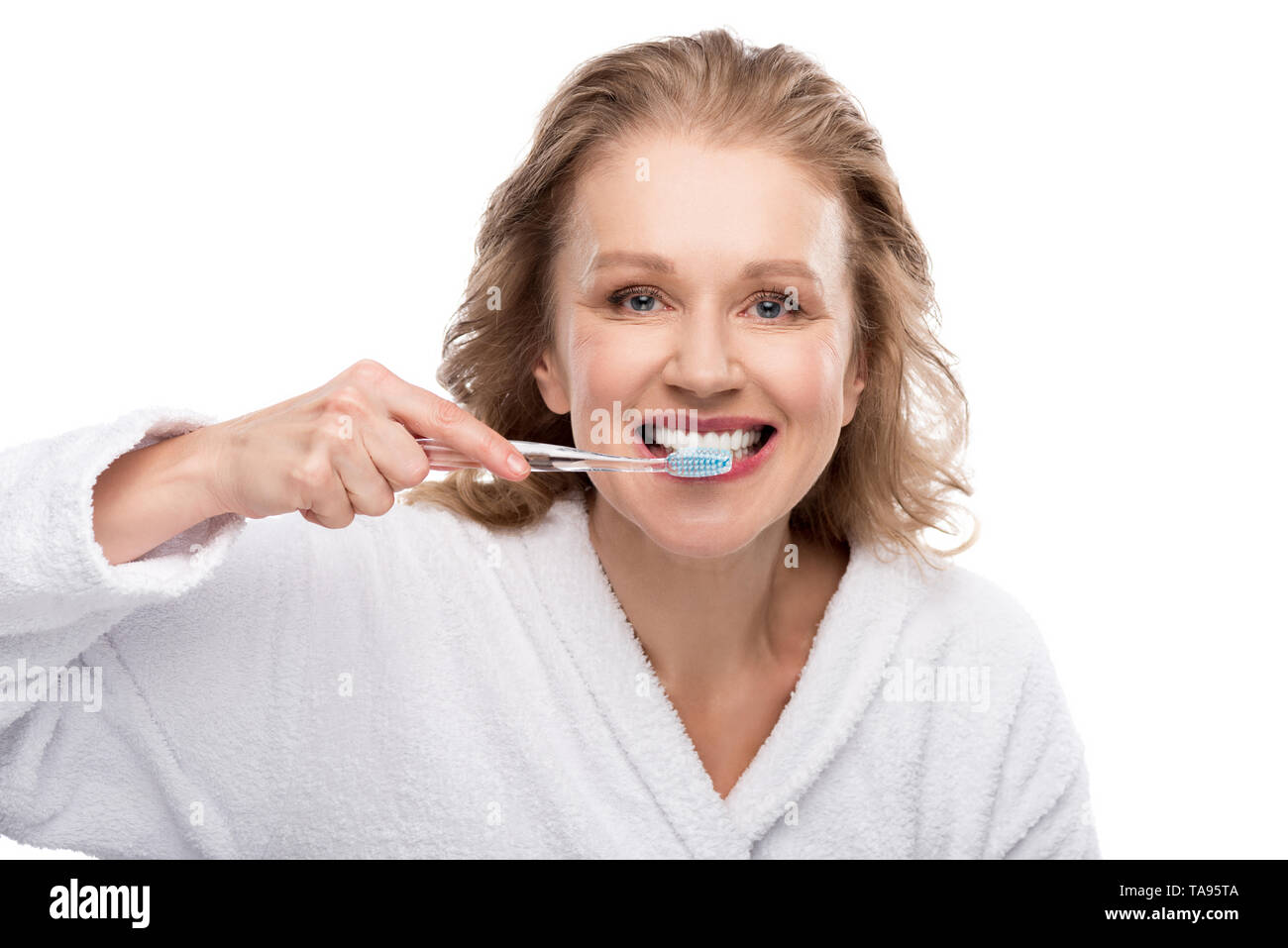 Middle Aged Woman Brushing Teeth Isolated On White Stock Photo Alamy