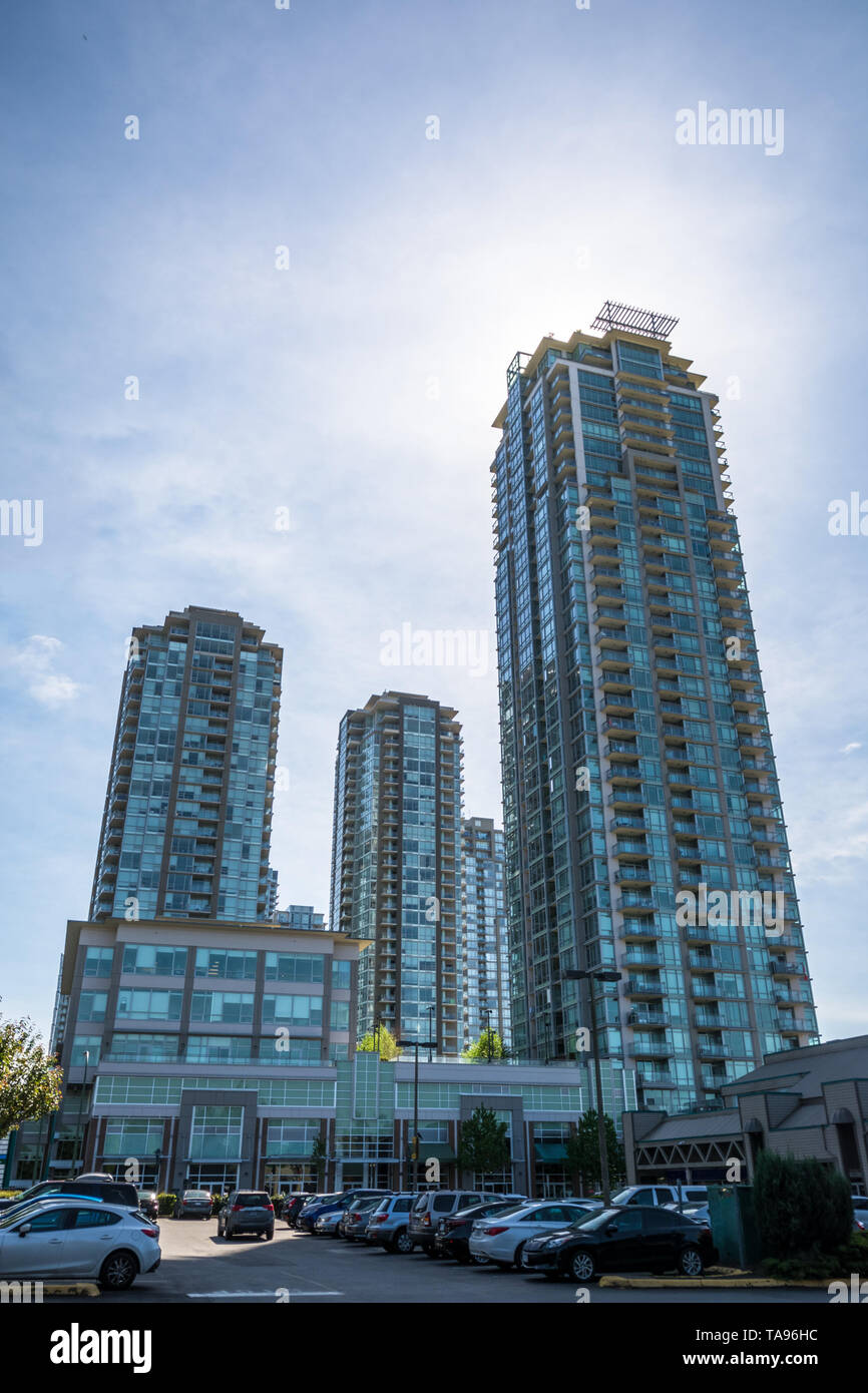 High rise residential buildings in Canada with cars parked on the plaza ...