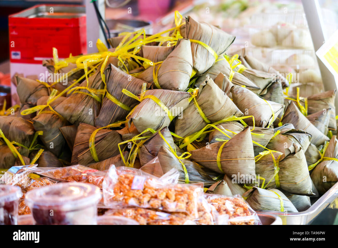 pyramid-shaped dumplings made by wrapping glutinous rice in bamboo ...