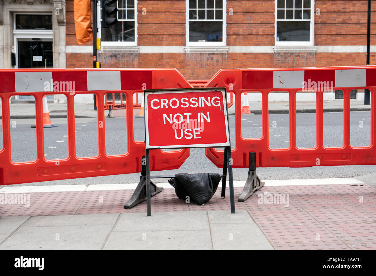 Crossing not in use road sign in a UK city street Stock Photo - Alamy