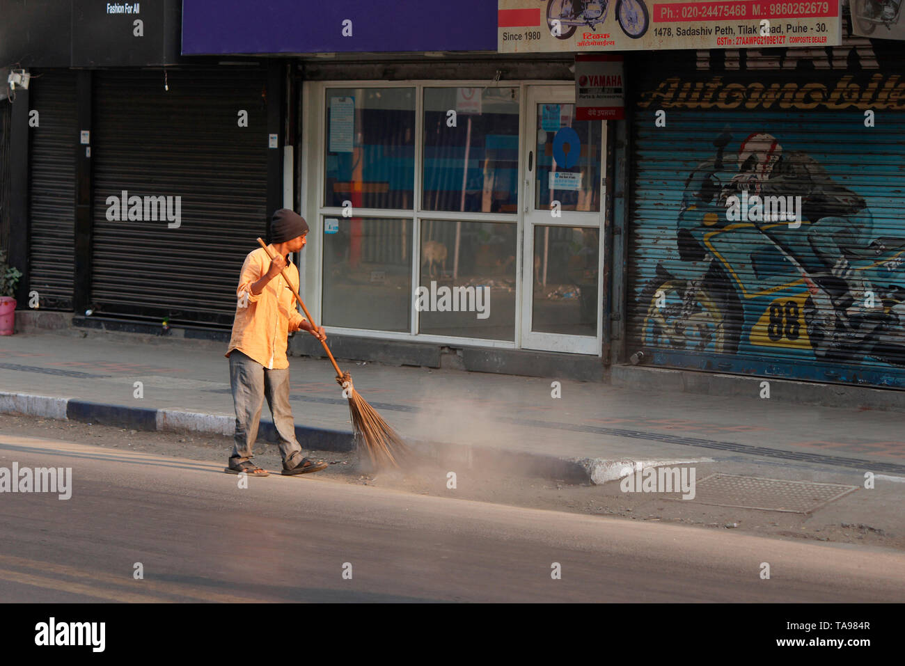 PUNE, MAHARASHTRA, INDIA, February 2019, Man clean street in the ...