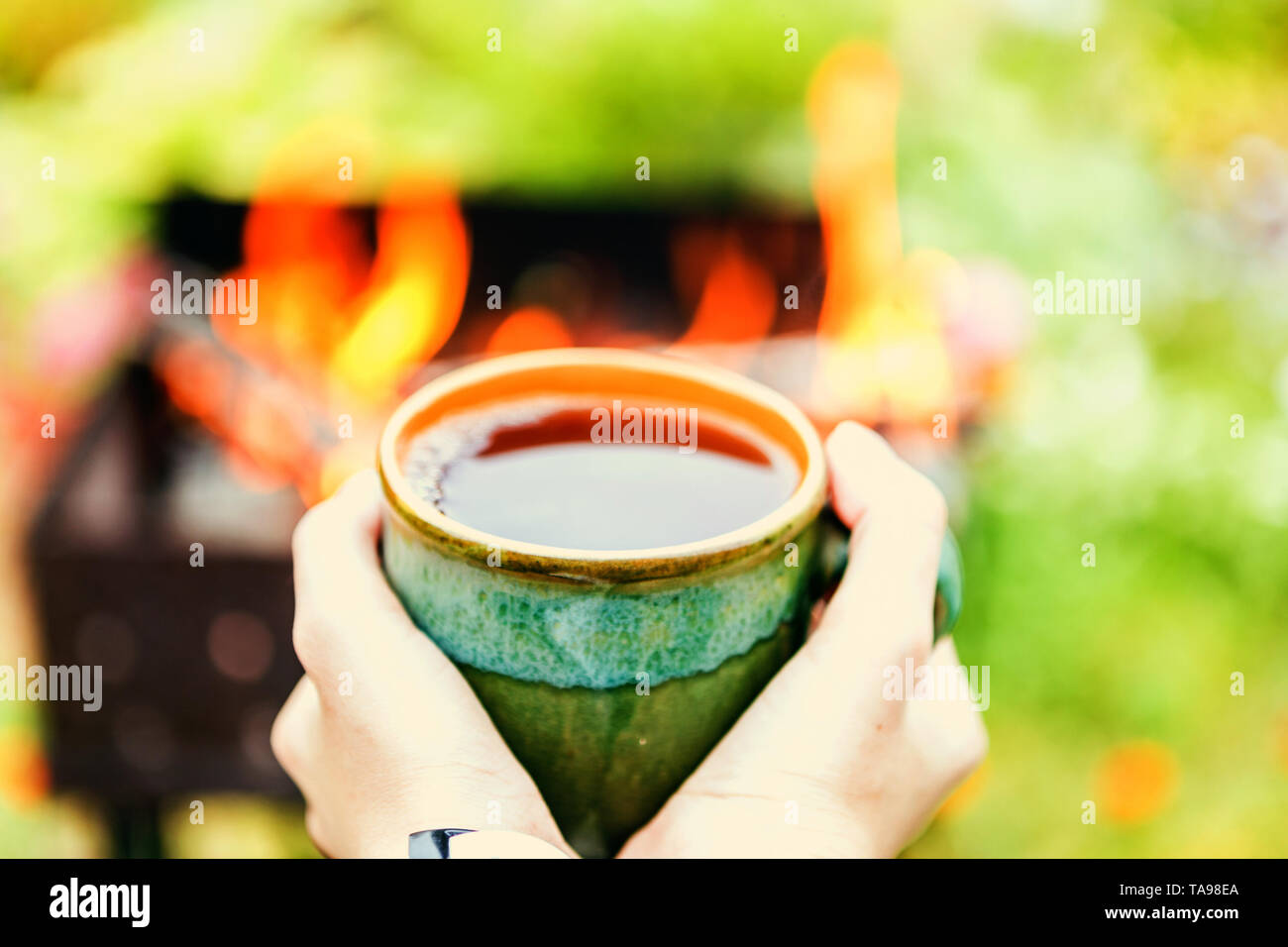 Hands holding tea cup Stock Photo - Alamy