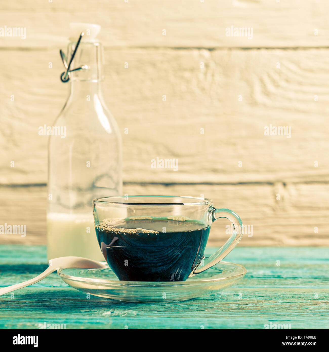 A cup of coffee with jug of milk Stock Photo - Alamy