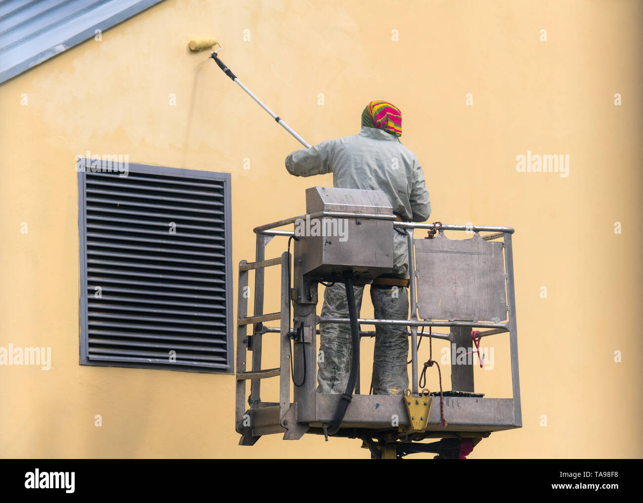 Worker Painting Wall