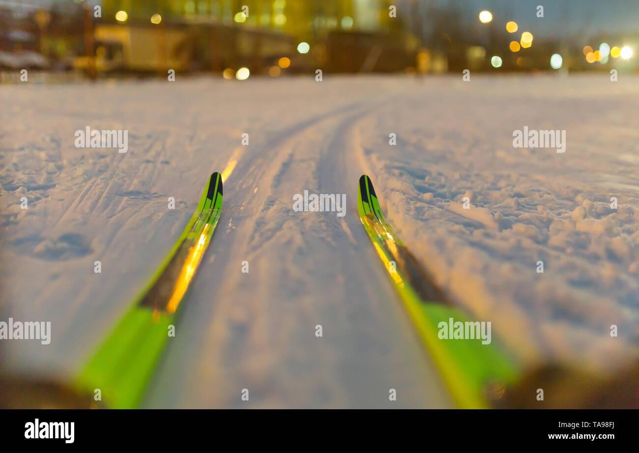 Photo of skis on background of burning lights Stock Photo - Alamy