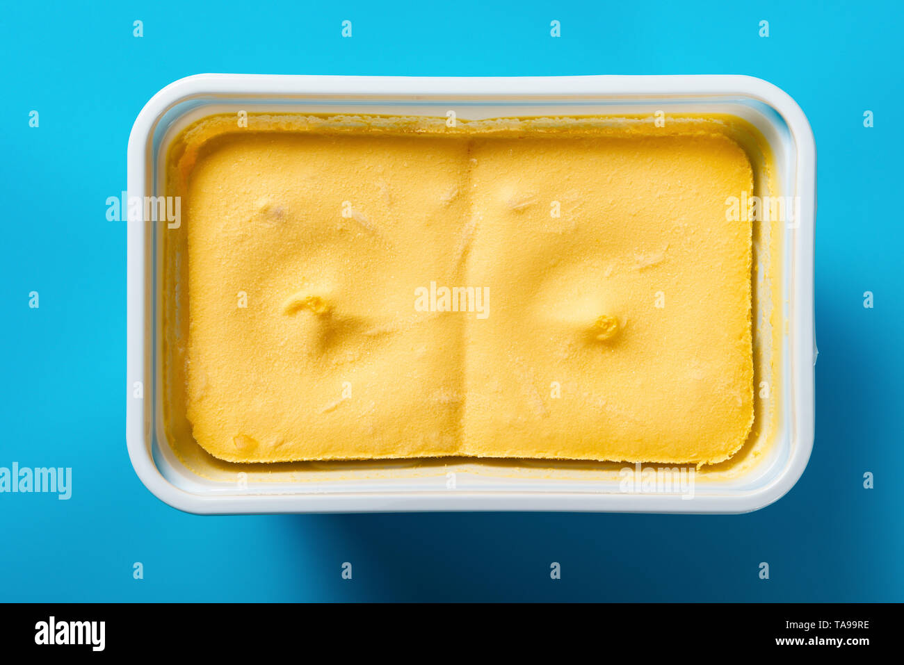top view box of mango flavor ice cream on blue background Stock Photo ...