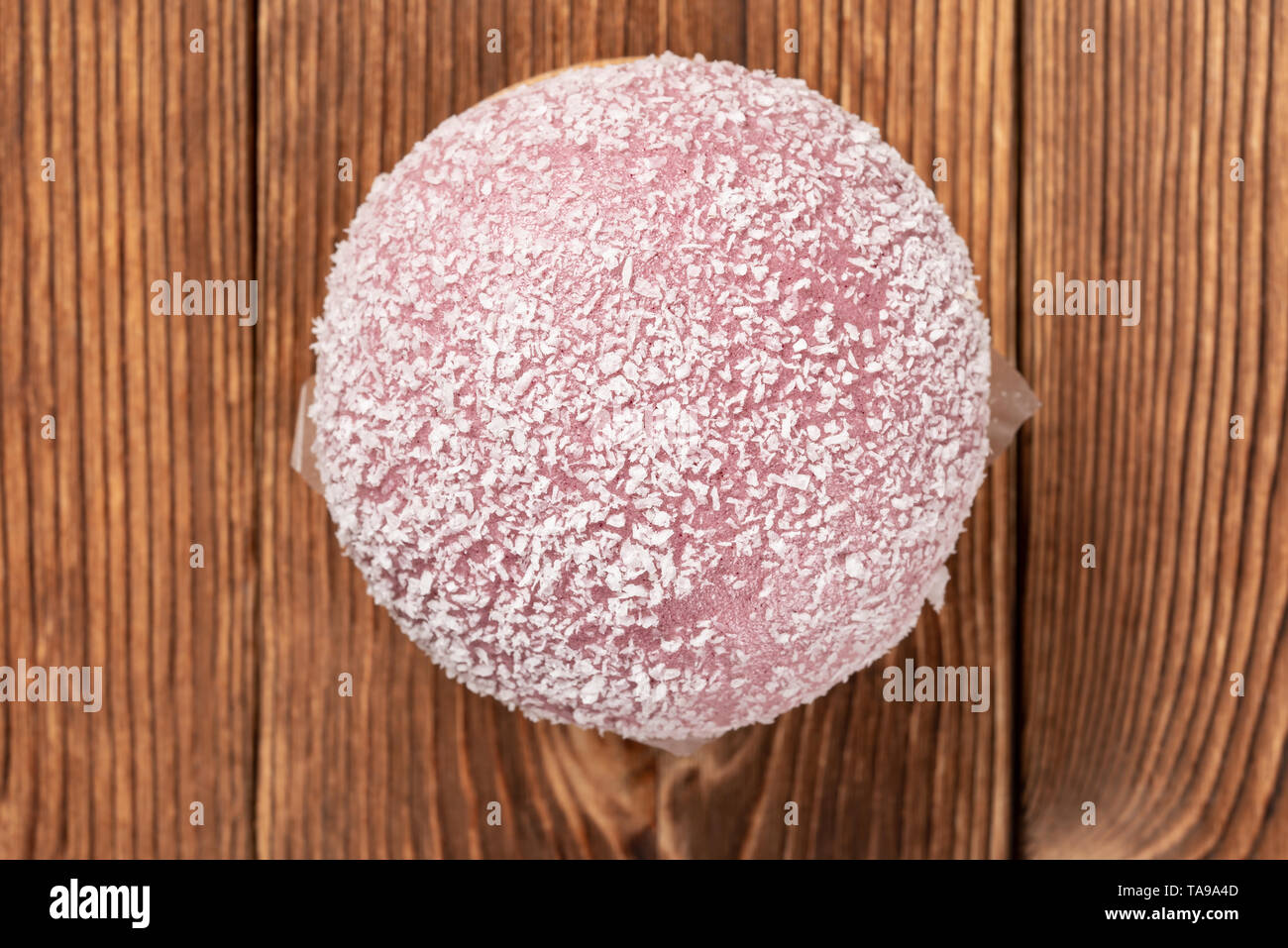 top view bun with shredded coconut on a wood table Stock Photo - Alamy