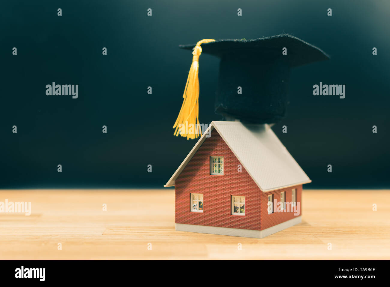 Concept for a smart home. A model house wears a graduation hat Stock ...