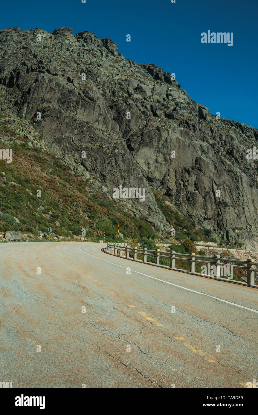 Concrete parapet in edge of road on rocky landscape at the highlands of ...