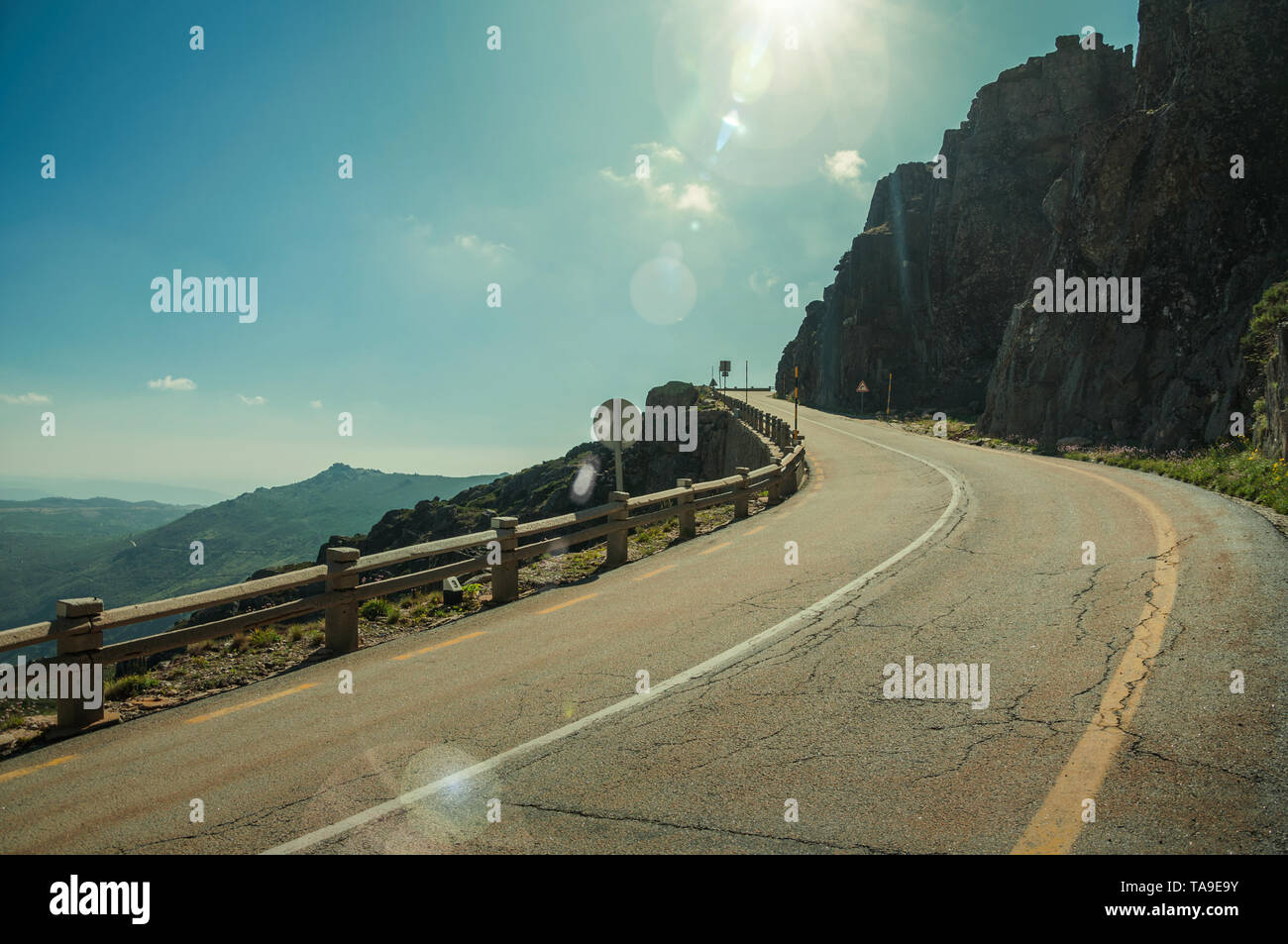Curve road with concrete parapet on rocky terrain, at the highlands of ...