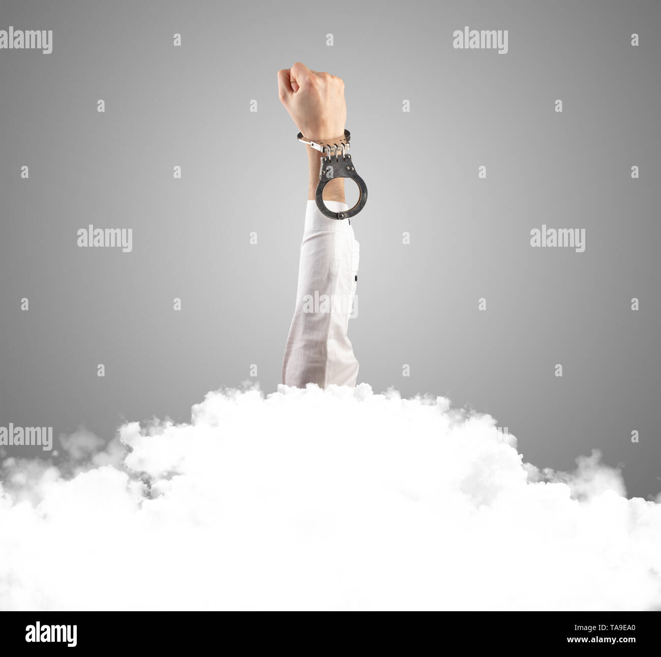 Hand breaking out from the cloud Stock Photo - Alamy