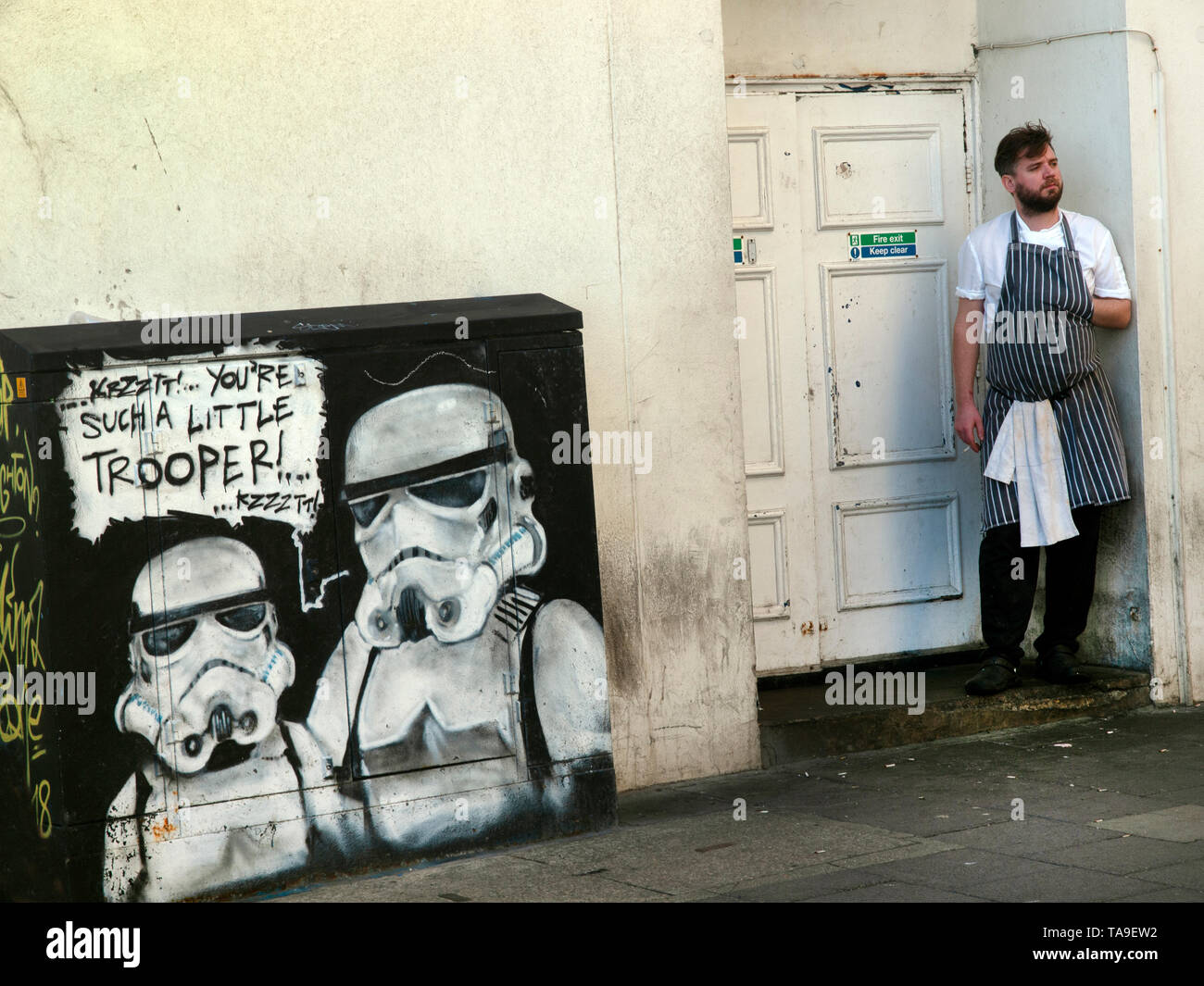 A chef takes a ciggie break outside in Brighton Stock Photo - Alamy