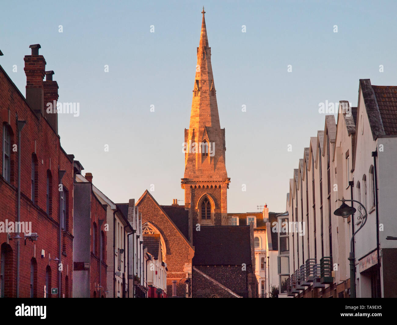 The spire of St Mary Magdalene Church rising above the houses of ...