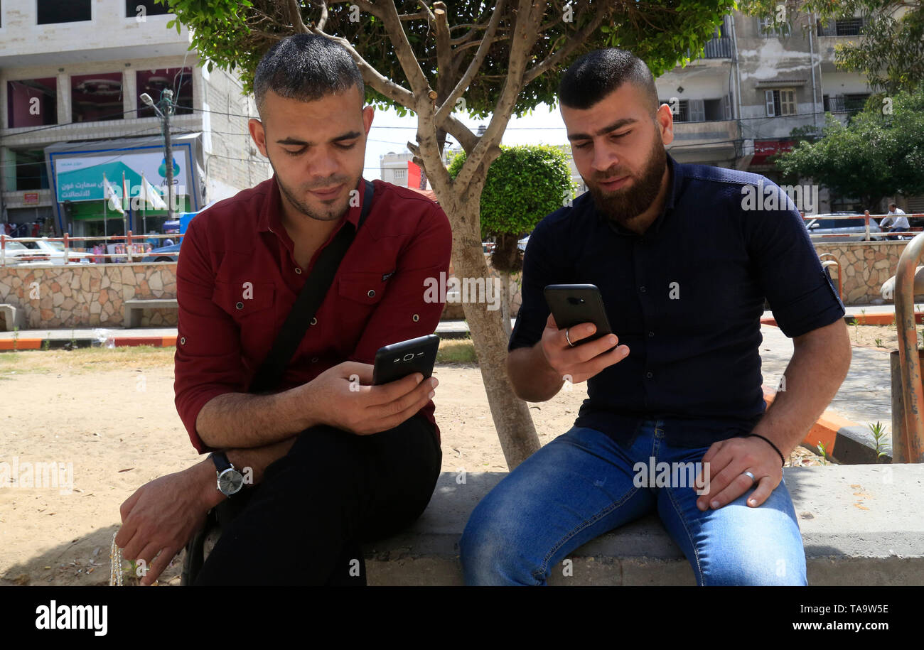 Gaza. 22nd May, 2019. Palestinian young men Amin Abed (R) and Mohammed ...