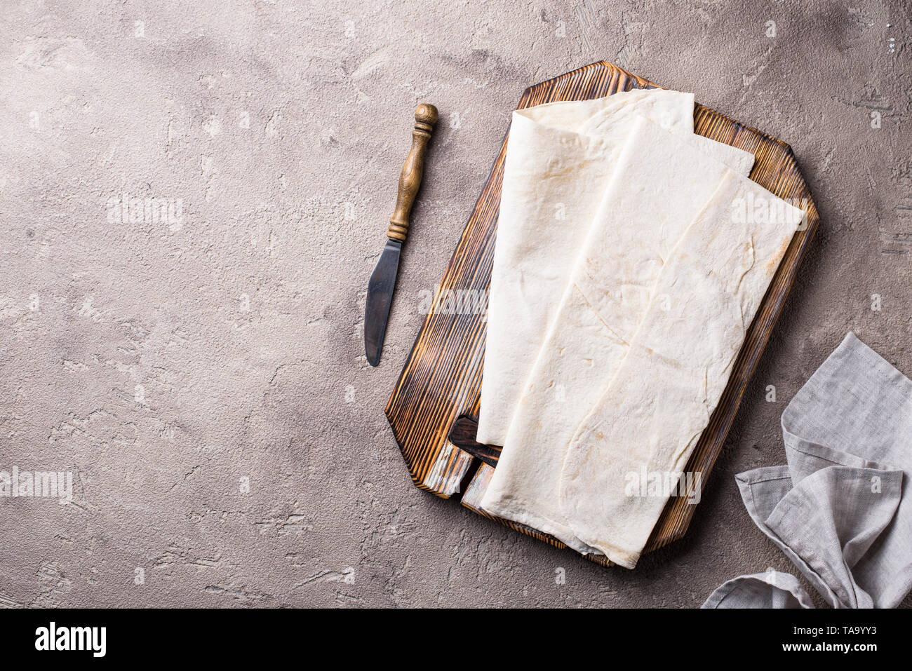 Armenian flat bread lavash on table Stock Photo - Alamy