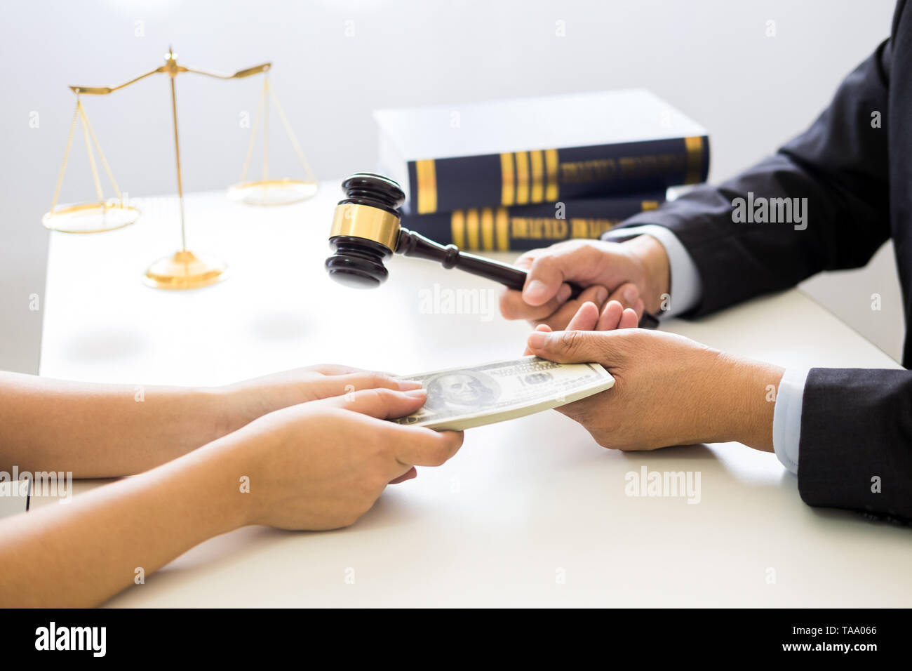Lawyer being offered receiving money as bribe from client at desk in ...