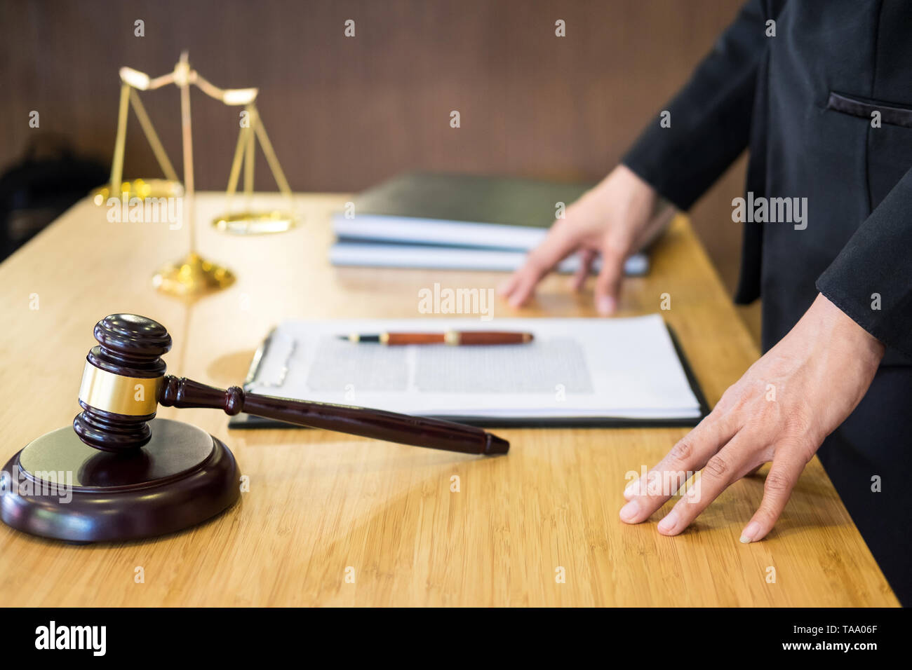 lawyer judge reading documents at desk in courtroom working on wooden ...