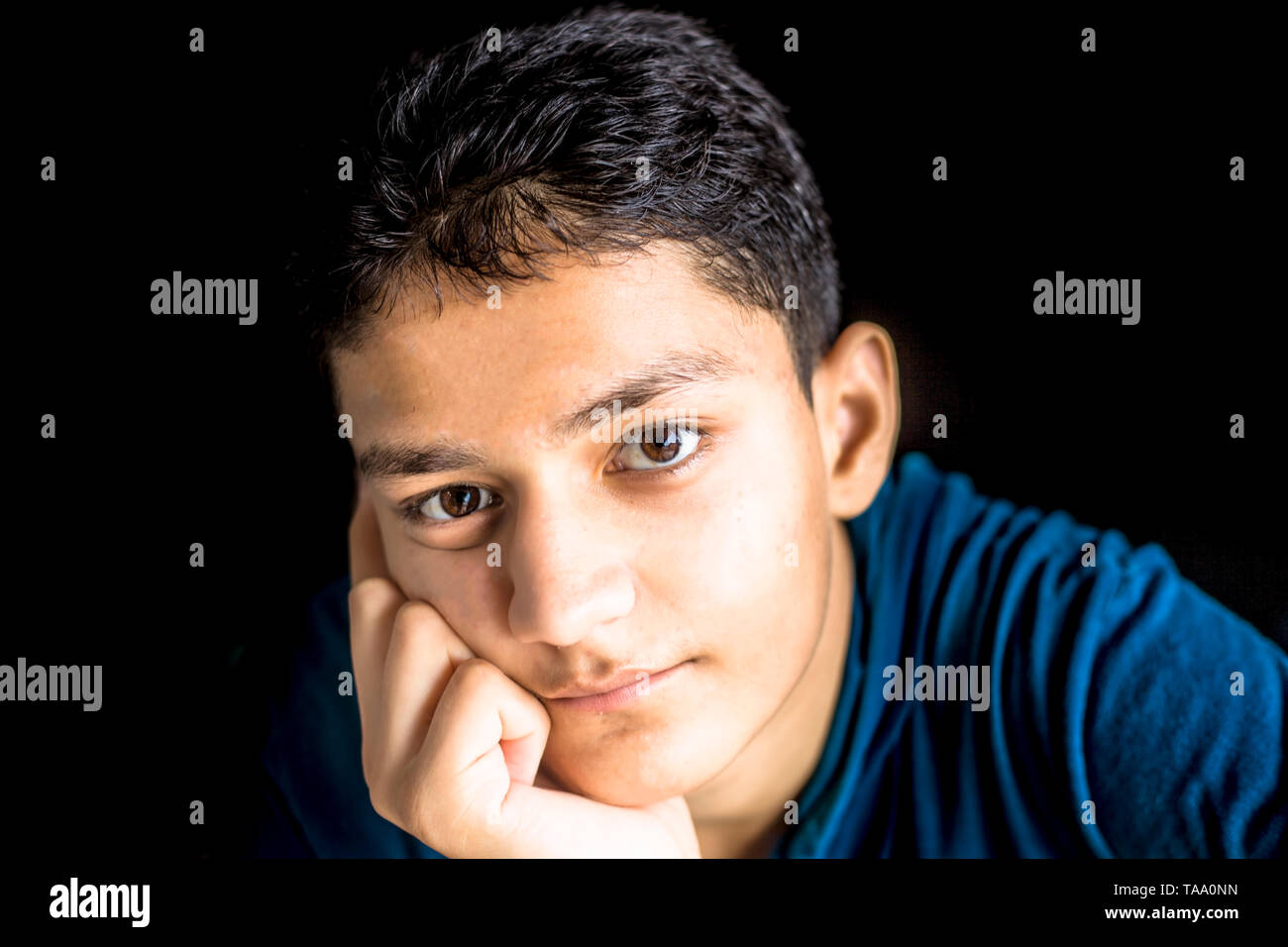 Portrait of a boy expressing sad feelings about some awkward situations ...