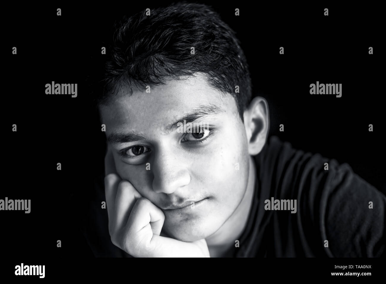 Portrait of a boy expressing sad feelings about some awkward situations ...