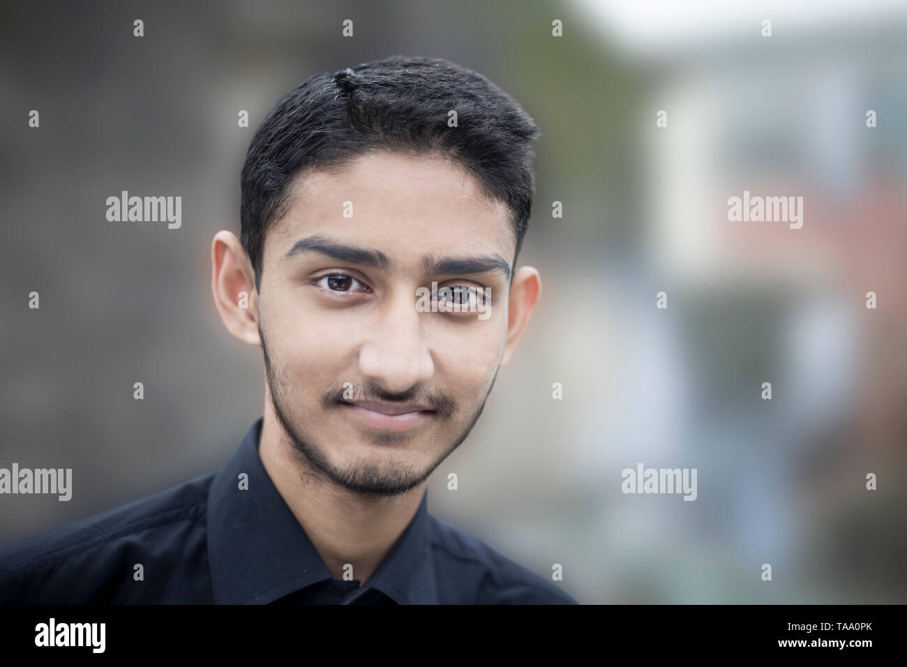 portrait of a handsome gentle man or business man wearing black colored ...