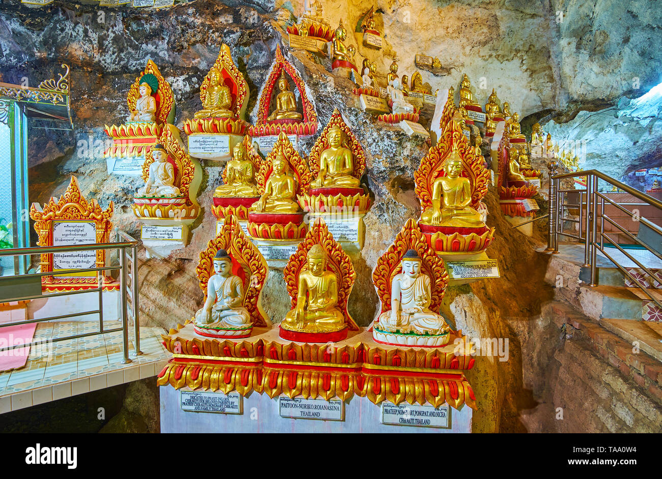 PINDAYA, MYANMAR - FEBRUARY 19, 2018: The rich decors of Buddha statues ...