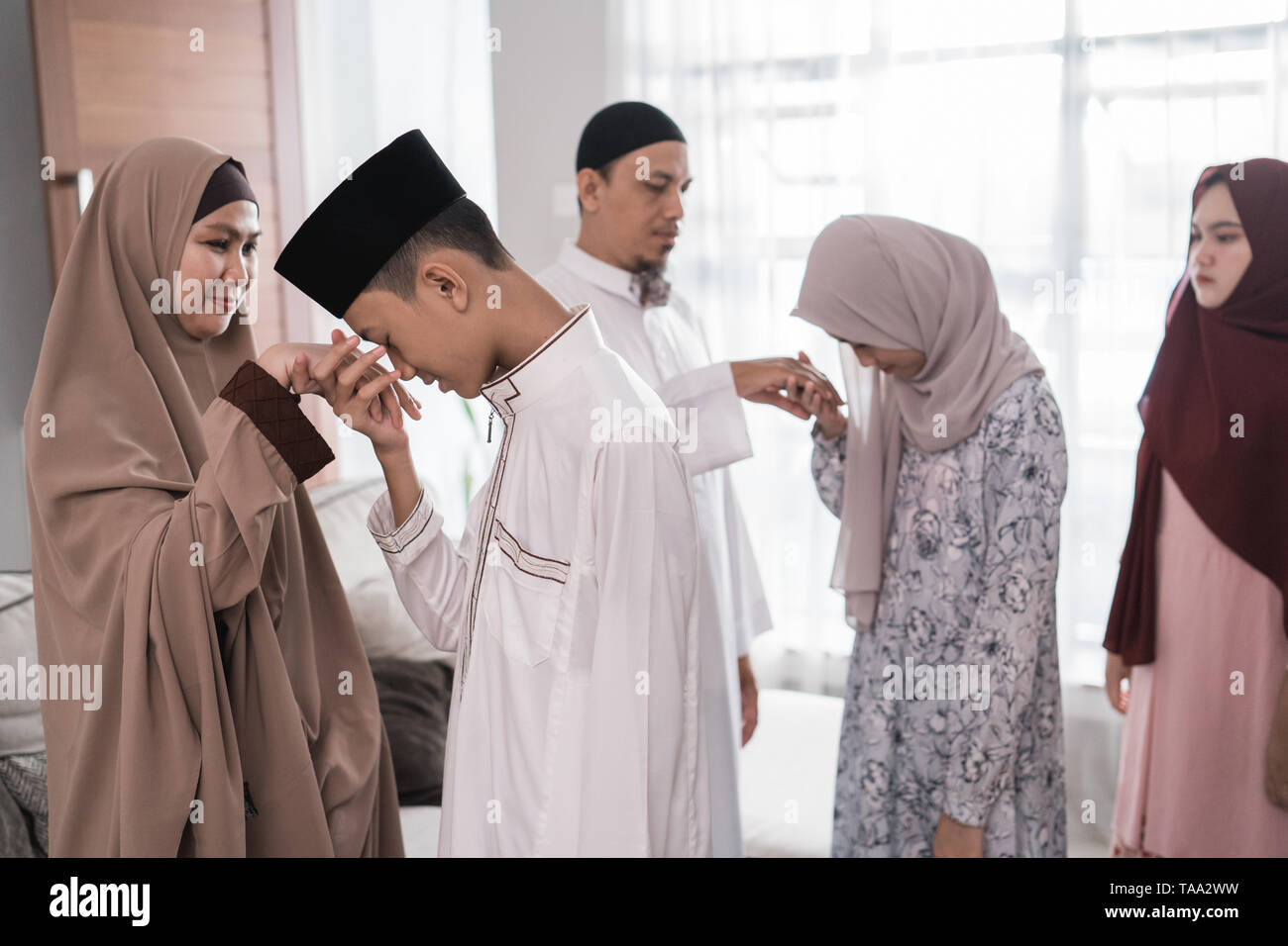 muslim family shake hand apologizing during the Eid mubarak ramadan ...