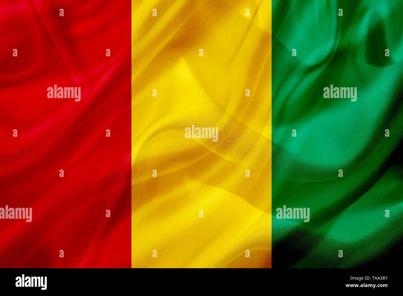 Guinea country flag symbol on silk or silky waving texture. Smooth ...