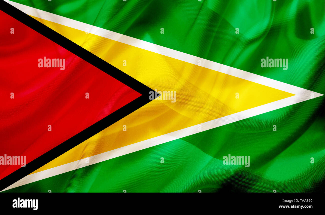 Guyana country flag symbol on silk or silky waving texture. Smooth ...