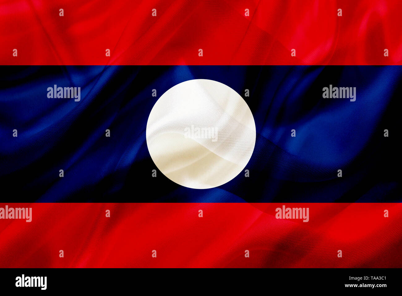 Laos country flag symbol on silk or silky waving texture. Smooth fabric ...