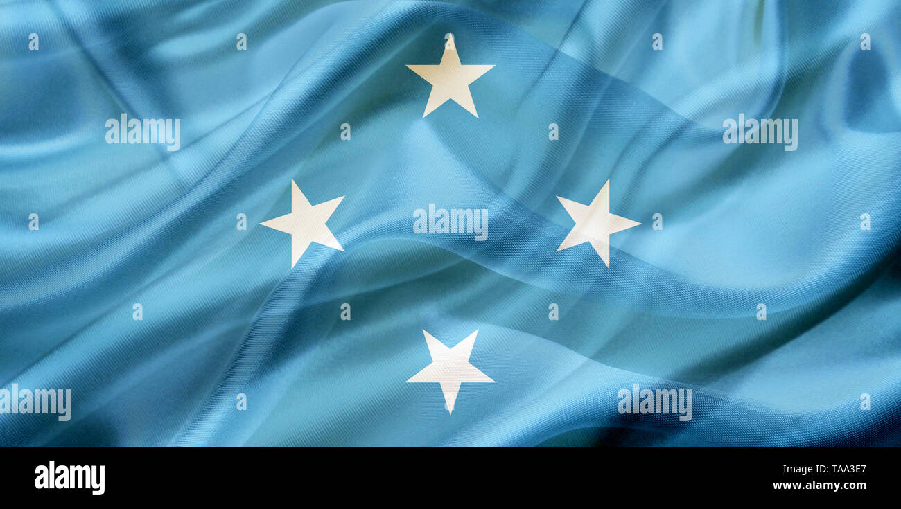 Micronesia country flag symbol on silk or silky waving texture. Smooth ...