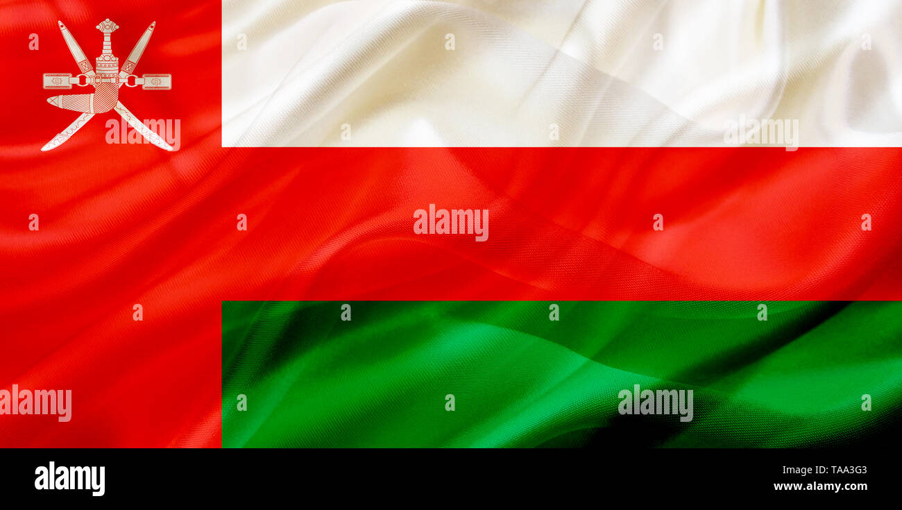 Oman country flag symbol on silk or silky waving texture. Smooth fabric ...