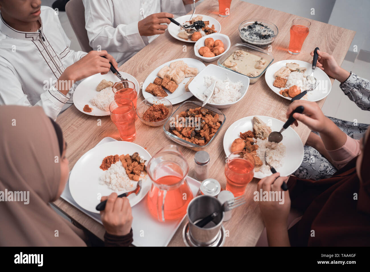 top view of hand eating in dinner table together with family Stock ...