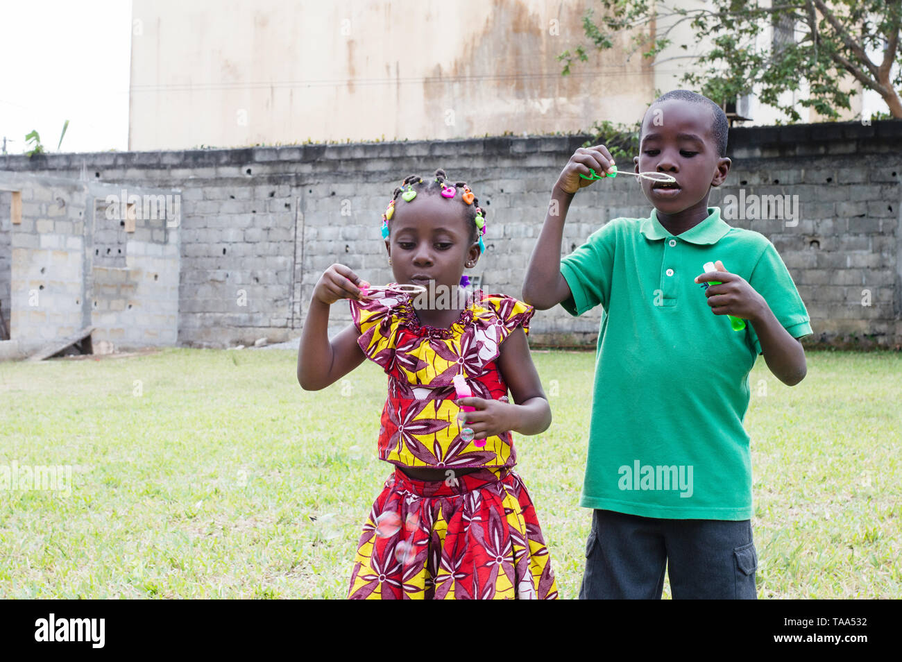 two happy children playing outdoors with soap bubble Stock Photo - Alamy