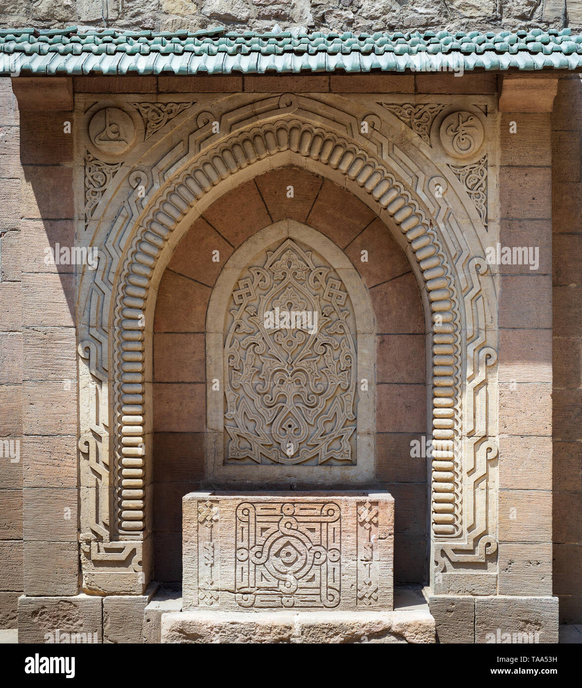 Stone sculpted drinking fountain (Sabil) with engraved floral ...