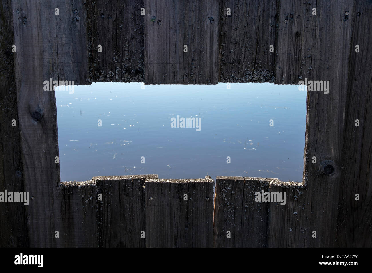 rectangular hole cut in wooden fence Stock Photo - Alamy