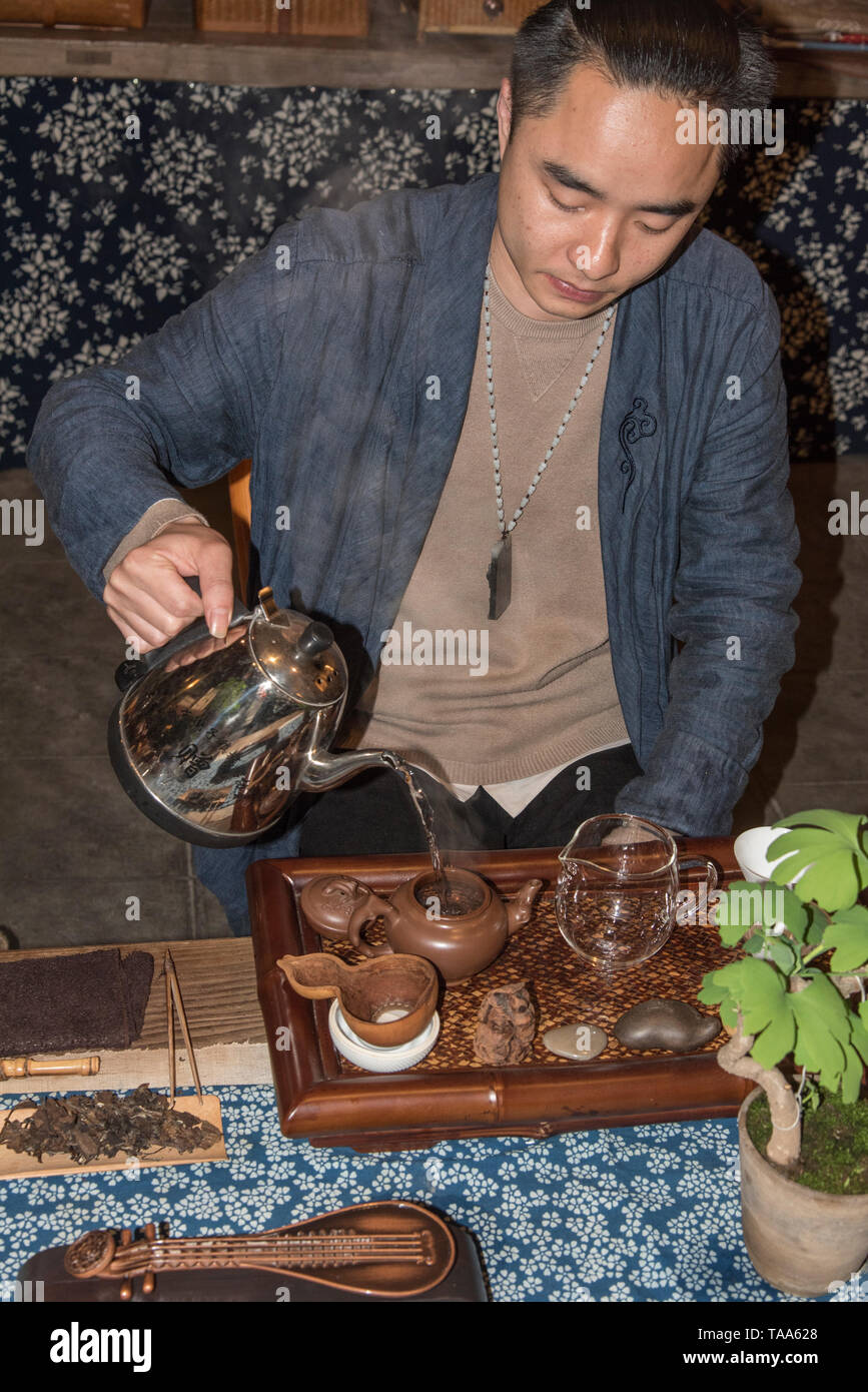 Chinese Tea Ceremony. Male server prepares the traditional tea ...