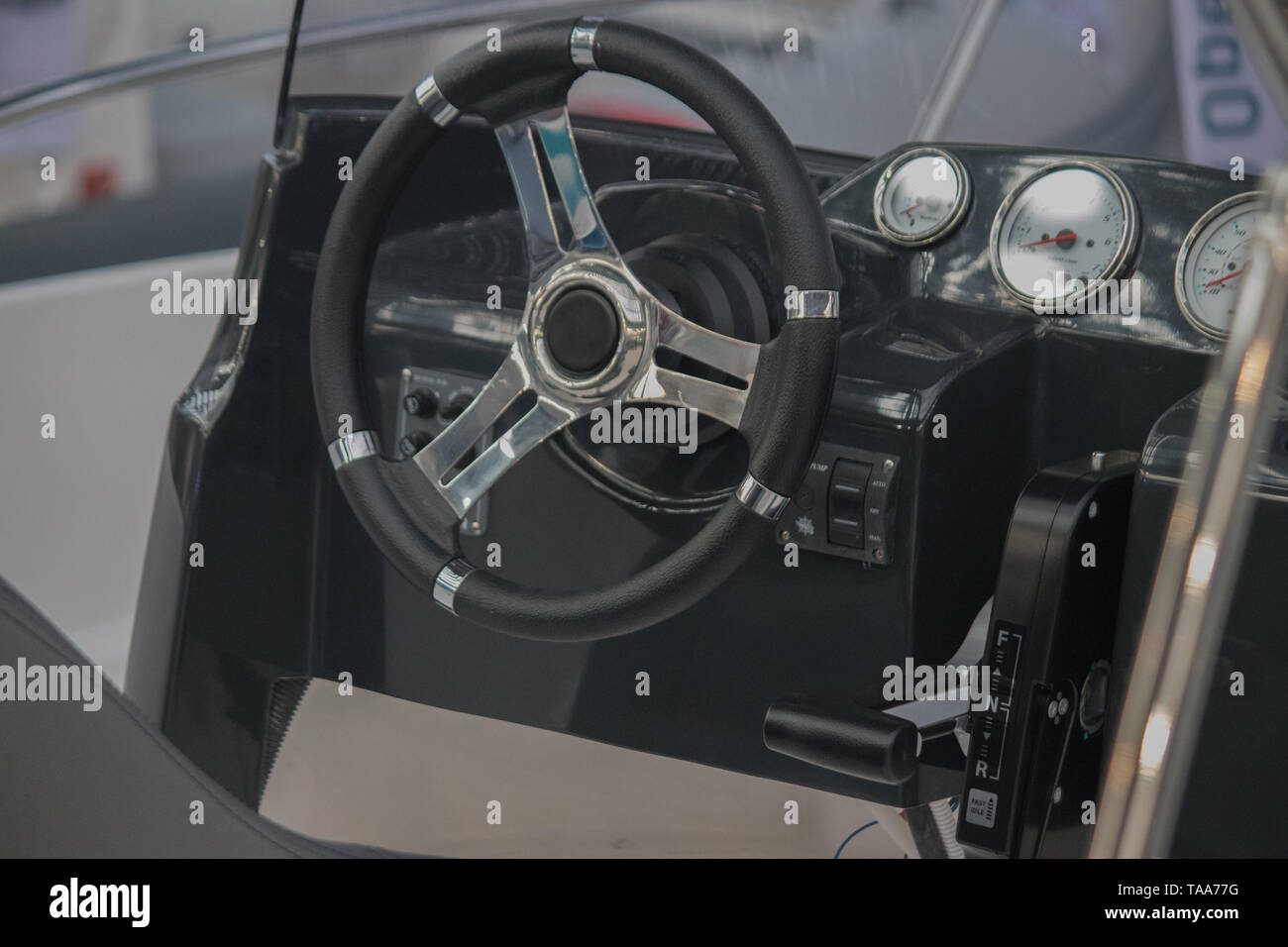 Steering and dashboard of luxury speed boat Stock Photo - Alamy