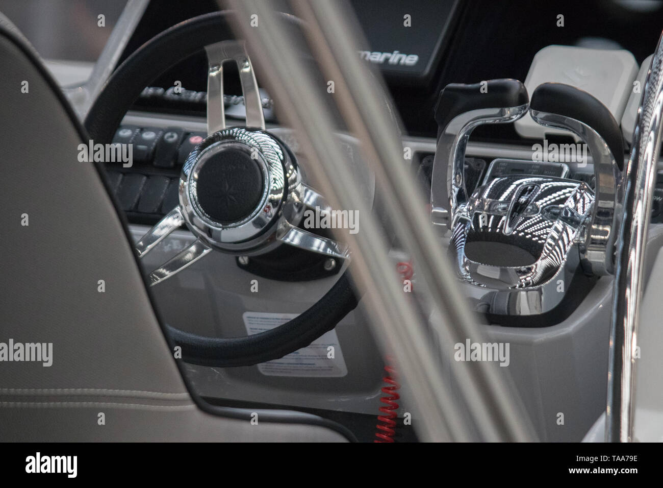 Steering and dashboard of luxury speed boat Stock Photo - Alamy